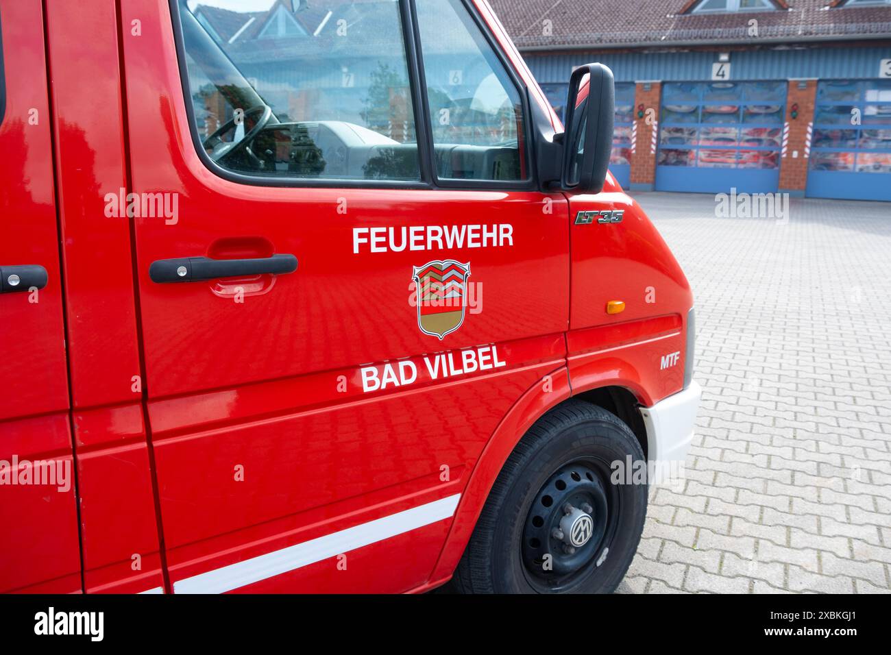 fire station building with red 112 fire engine, voluntary fire brigade ...