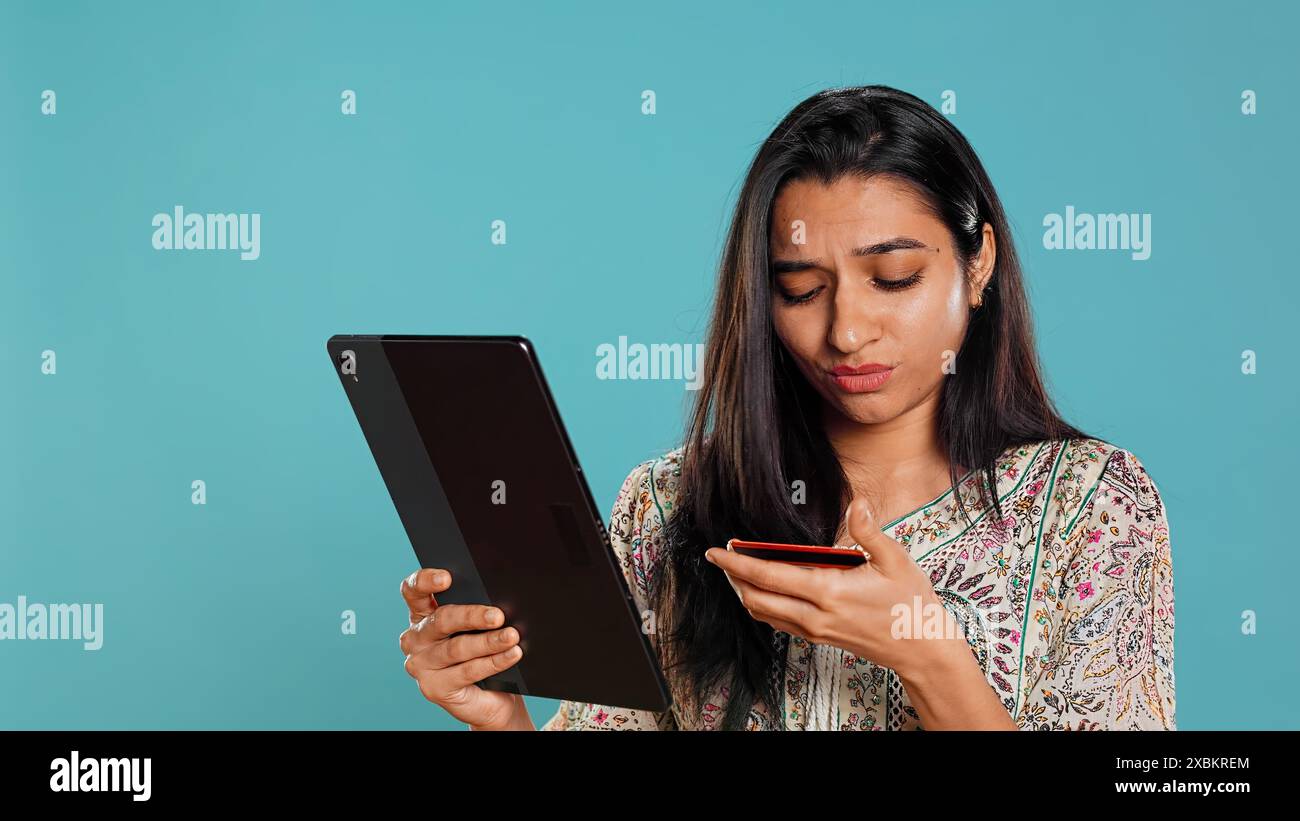 Woman trying to do purchases, frustrated with error received while ...