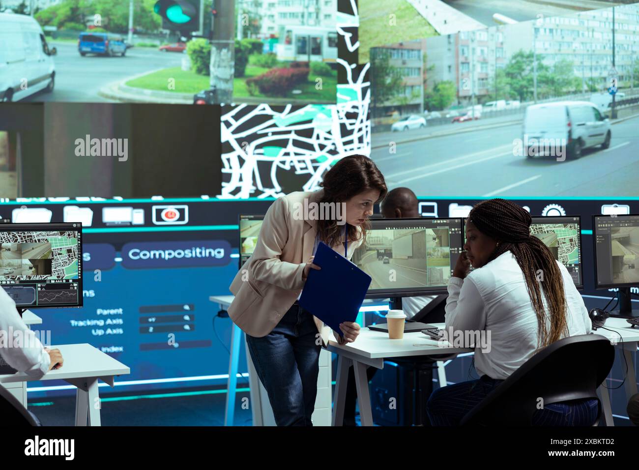 Diverse staff looking at import logistics to help with order tracking ...