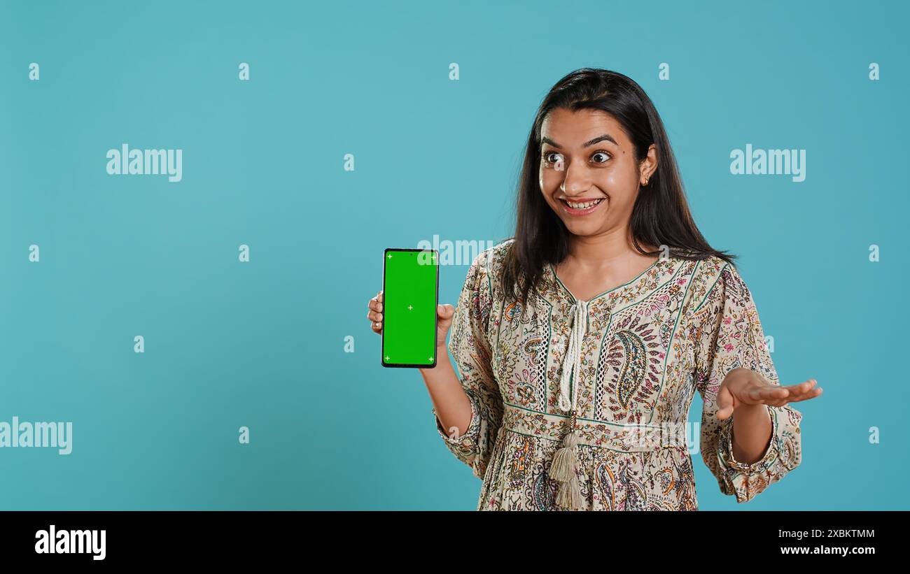 Tech content creator doing influencer marketing using green screen ...