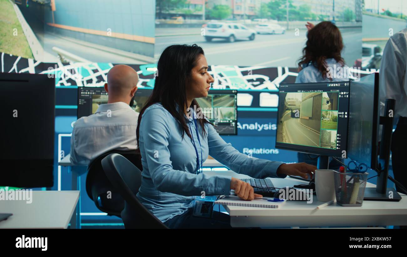 Indian employee collecting and transmitting information to couriers ...