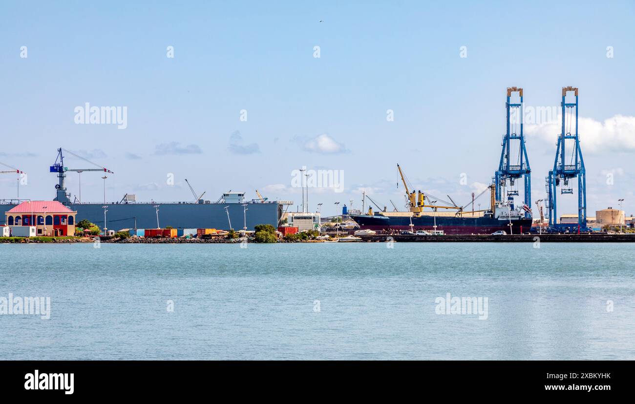 Djibouti city port cargo terminal with cranes, repair dock and ships ...