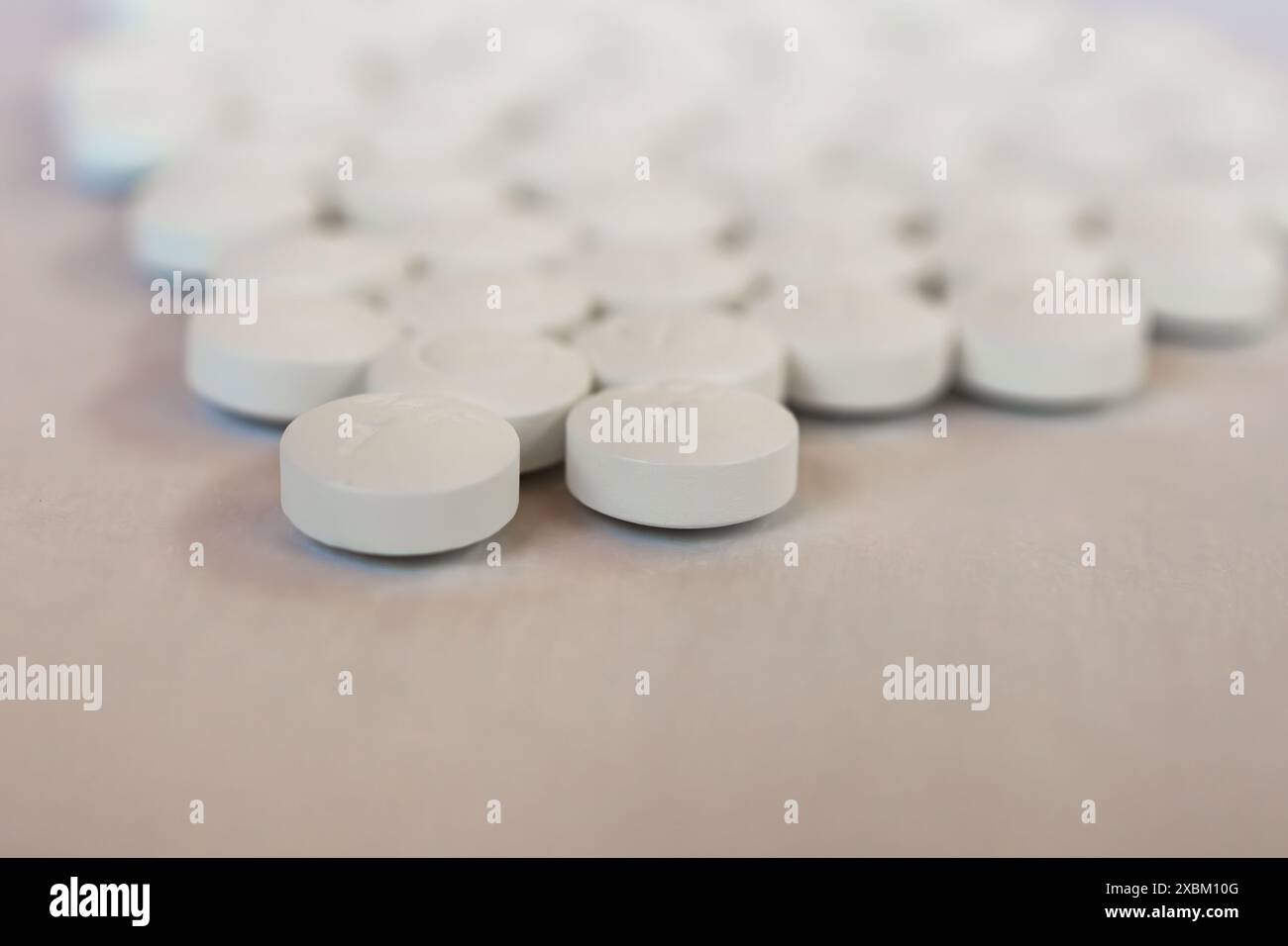 Generic metformin dispensed from a pharmacy 500 mg tablets on a white ...