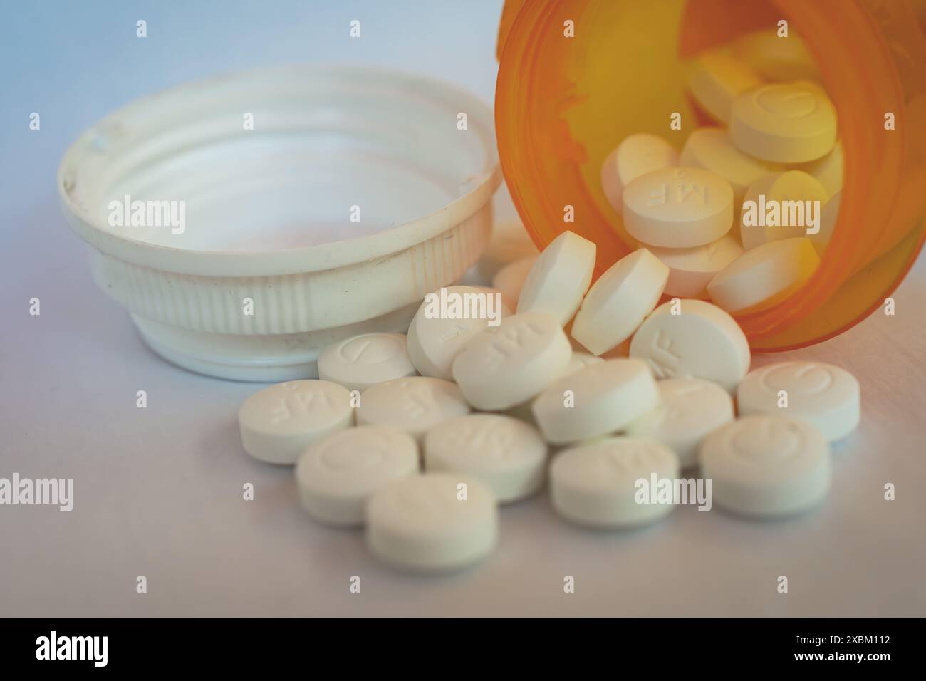 Generic metformin dispensed from a pharmacy 500 mg tablets on a white ...