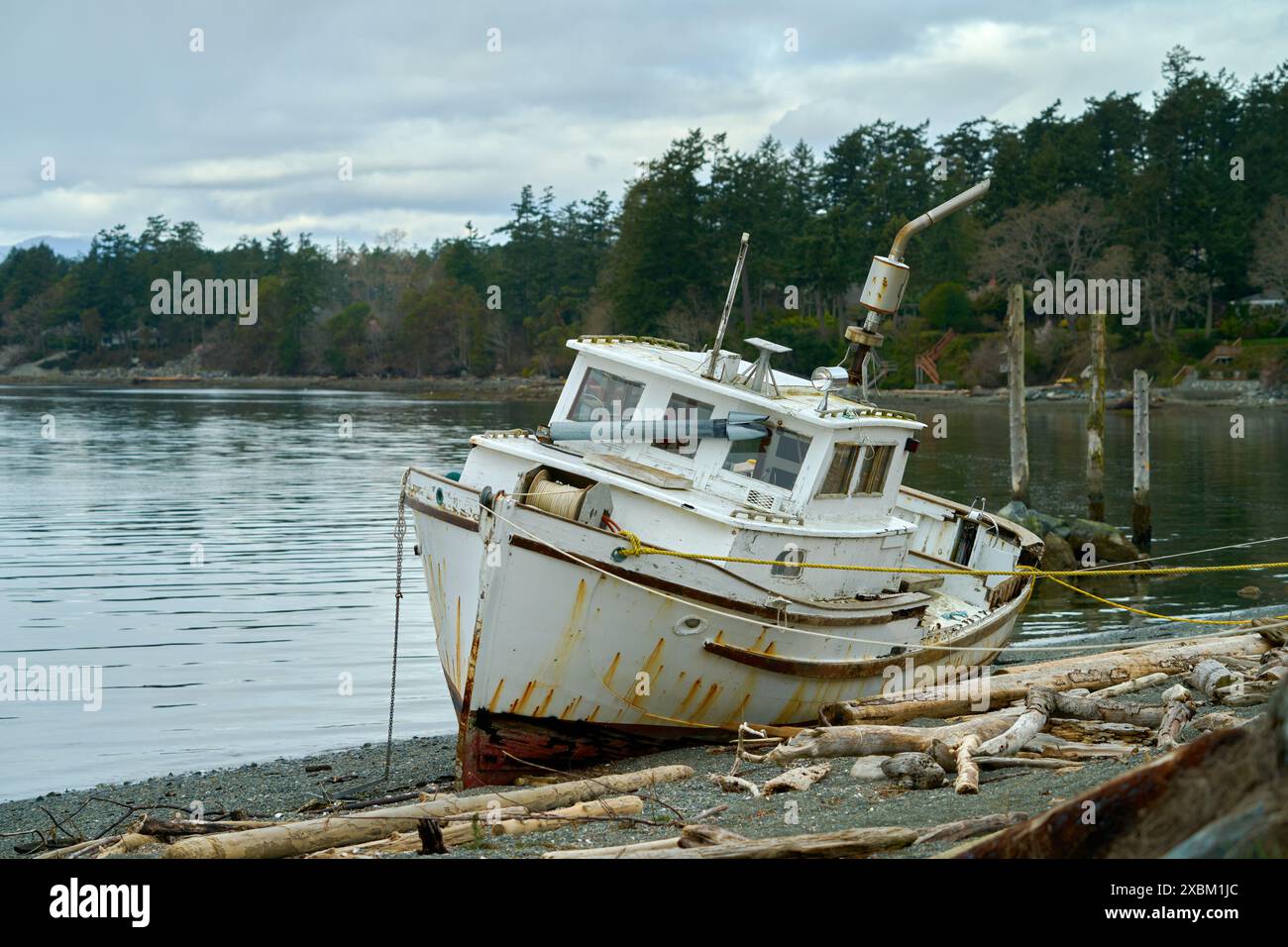 Trawler Beached. A trawler beached on the shore in the Pacific ...