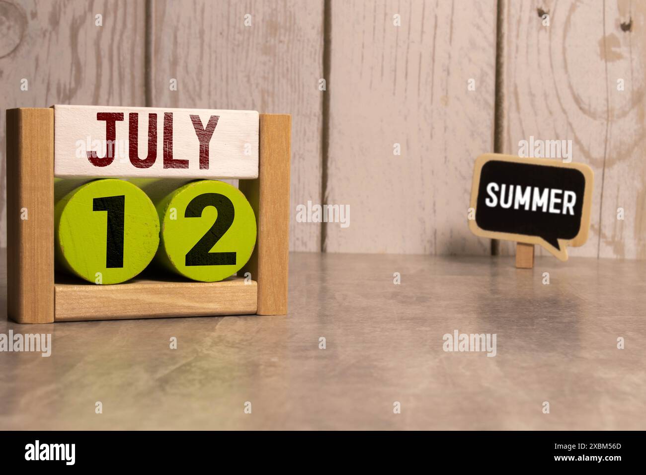 12 july wooden calendar in white background Stock Photo - Alamy