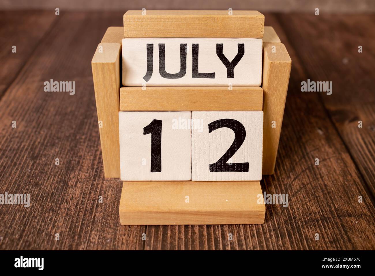 12 july wooden calendar in white background Stock Photo - Alamy