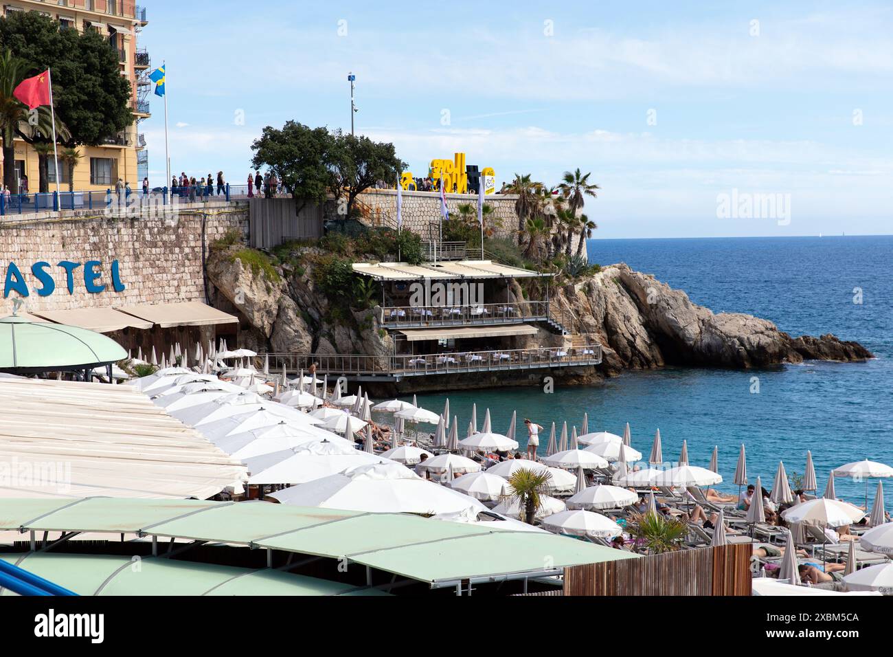 Nice, France - June 12, 2024: Castel Beach in Nice, France, offers a ...