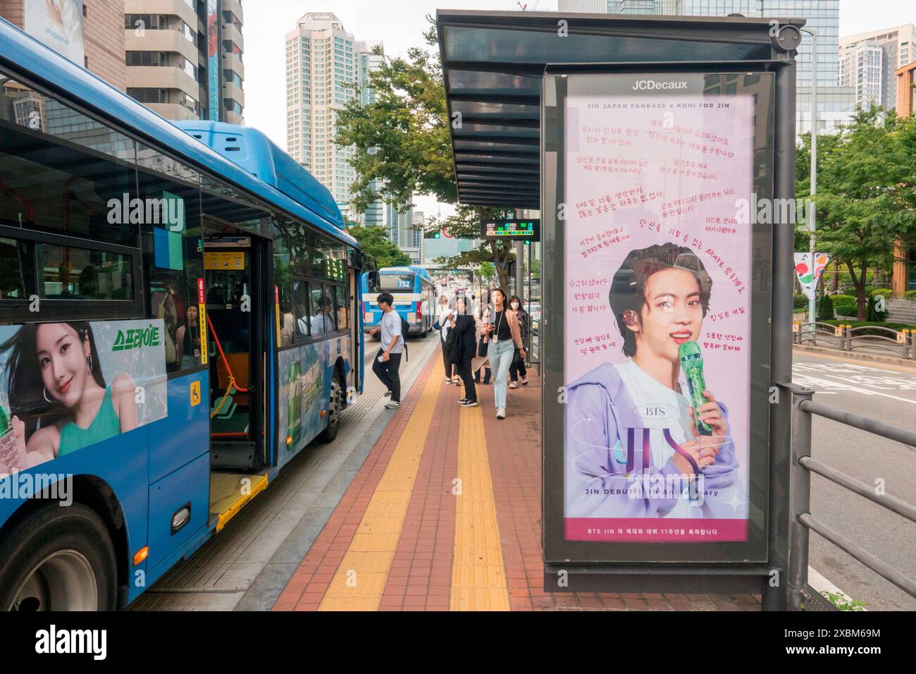 BTS Jin, June 12, 2024 : A bus stop decorated with an advertisement by ...