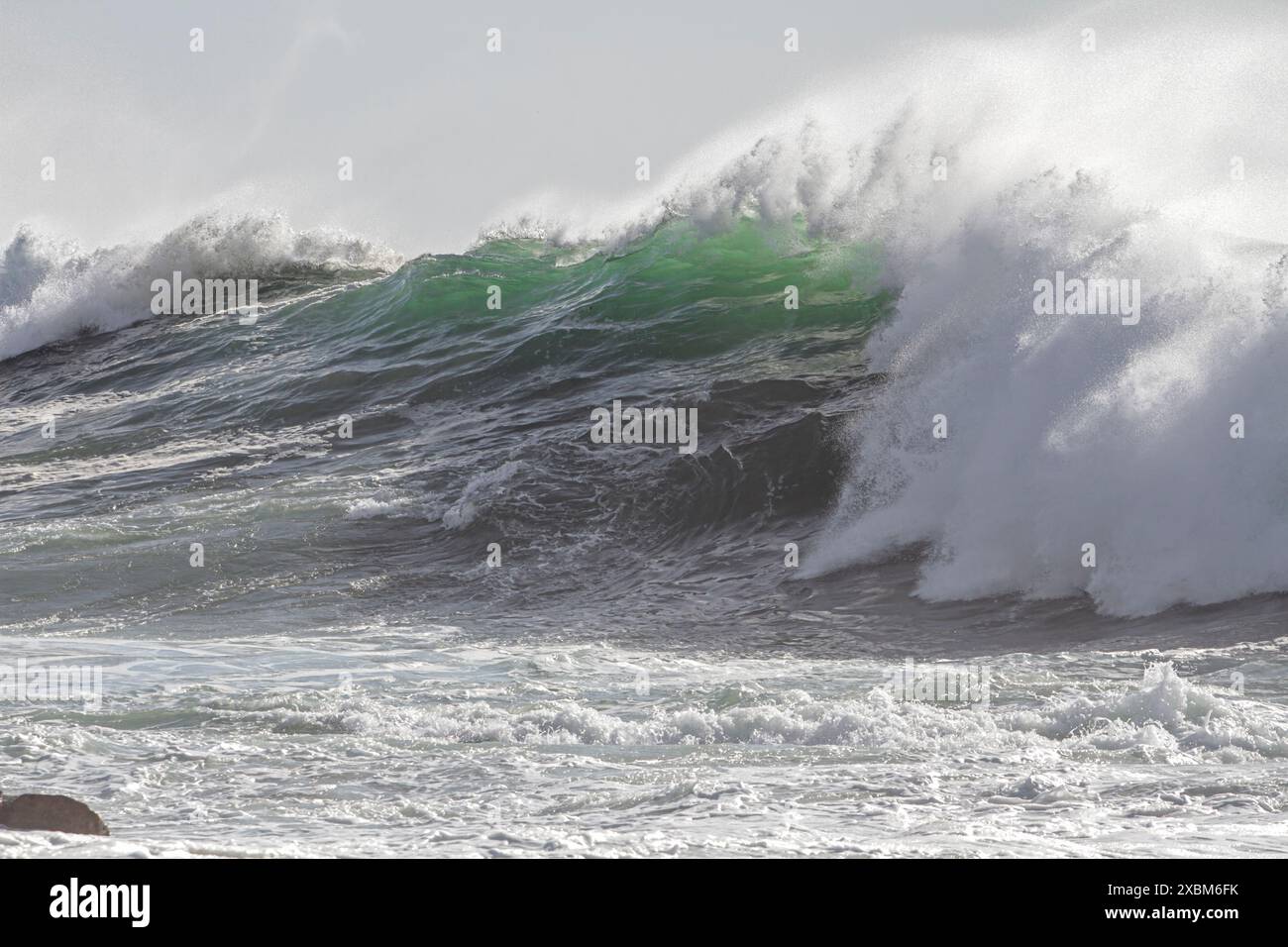 Top of a big breaking ocean green wave with spry closeup Stock Photo ...