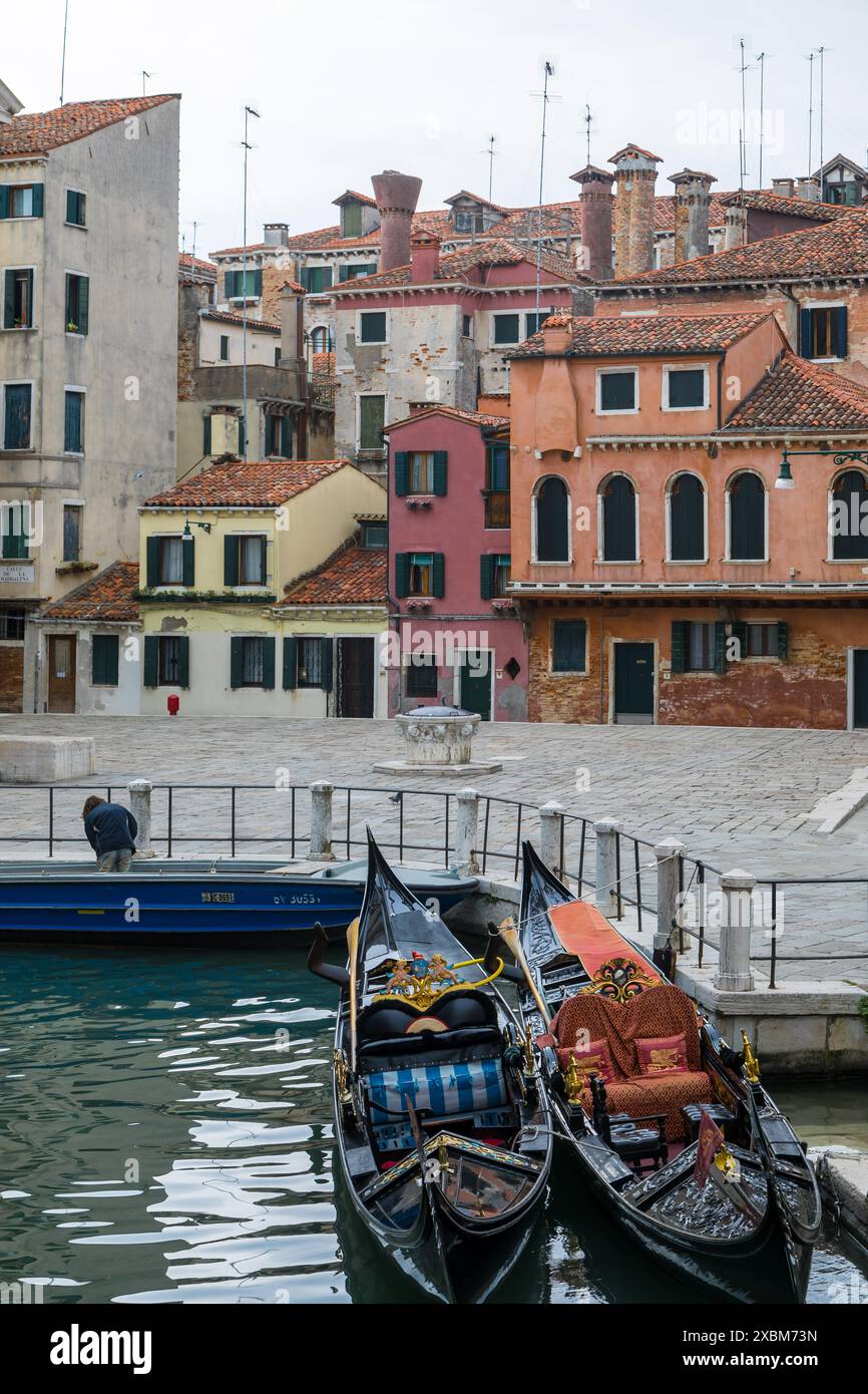 Venice Italy, urban, canal setting, boats and gondolas in the waterway ...