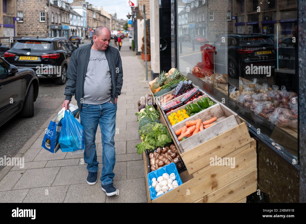 12 June 2024. High Street,Elgin,Moray,Scotland. This is a man looking ...