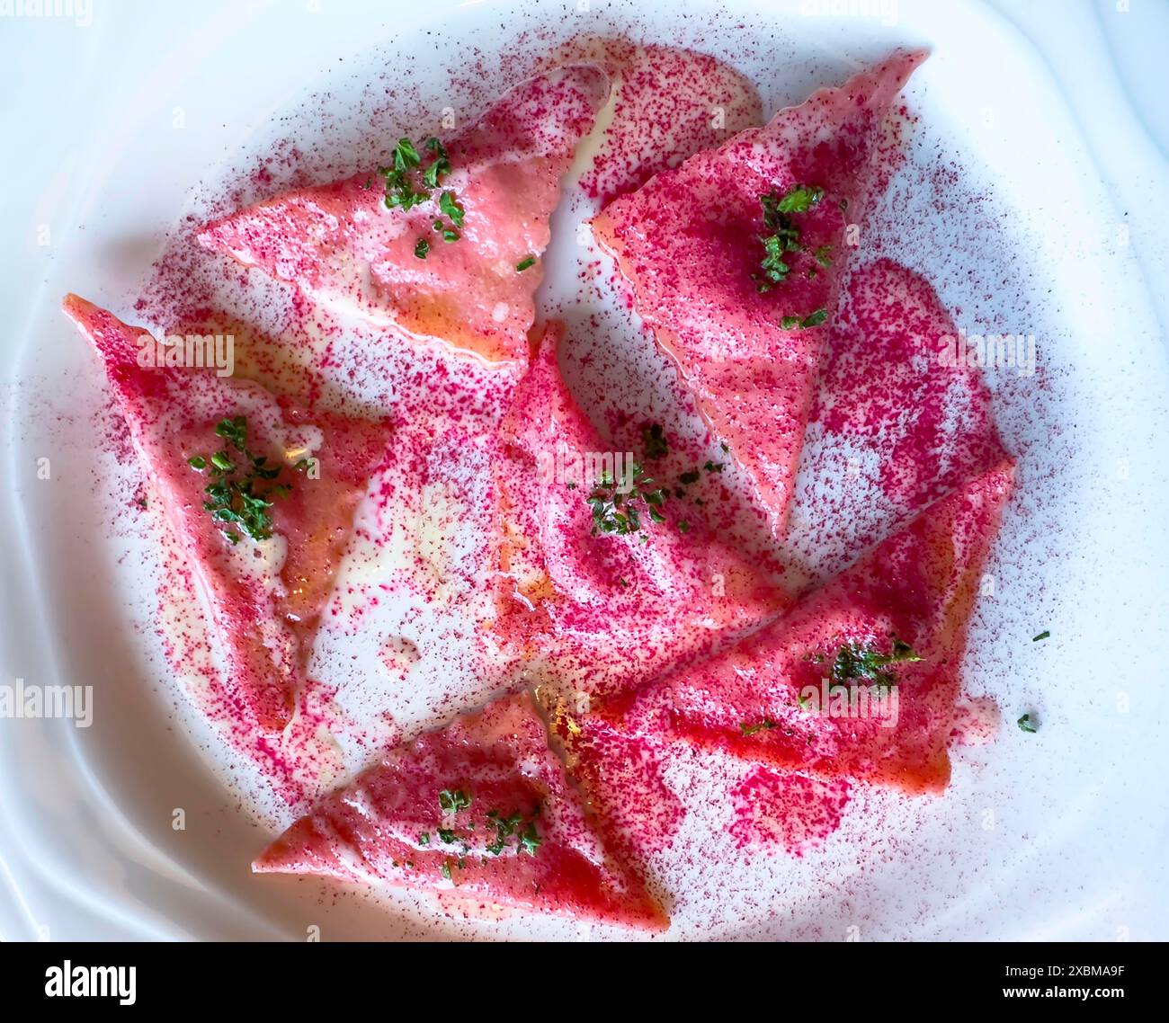 Restaurant Table with Beetroot Ravioli on a White Plate in Switzerland ...