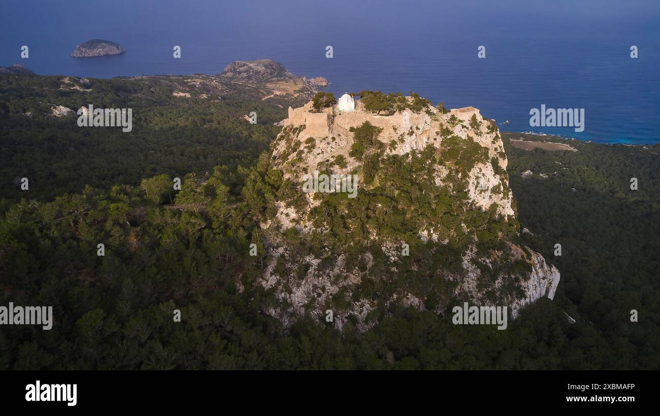 Aerial view of a castle on a wooded hill at dusk, Kastro Monolithou ...