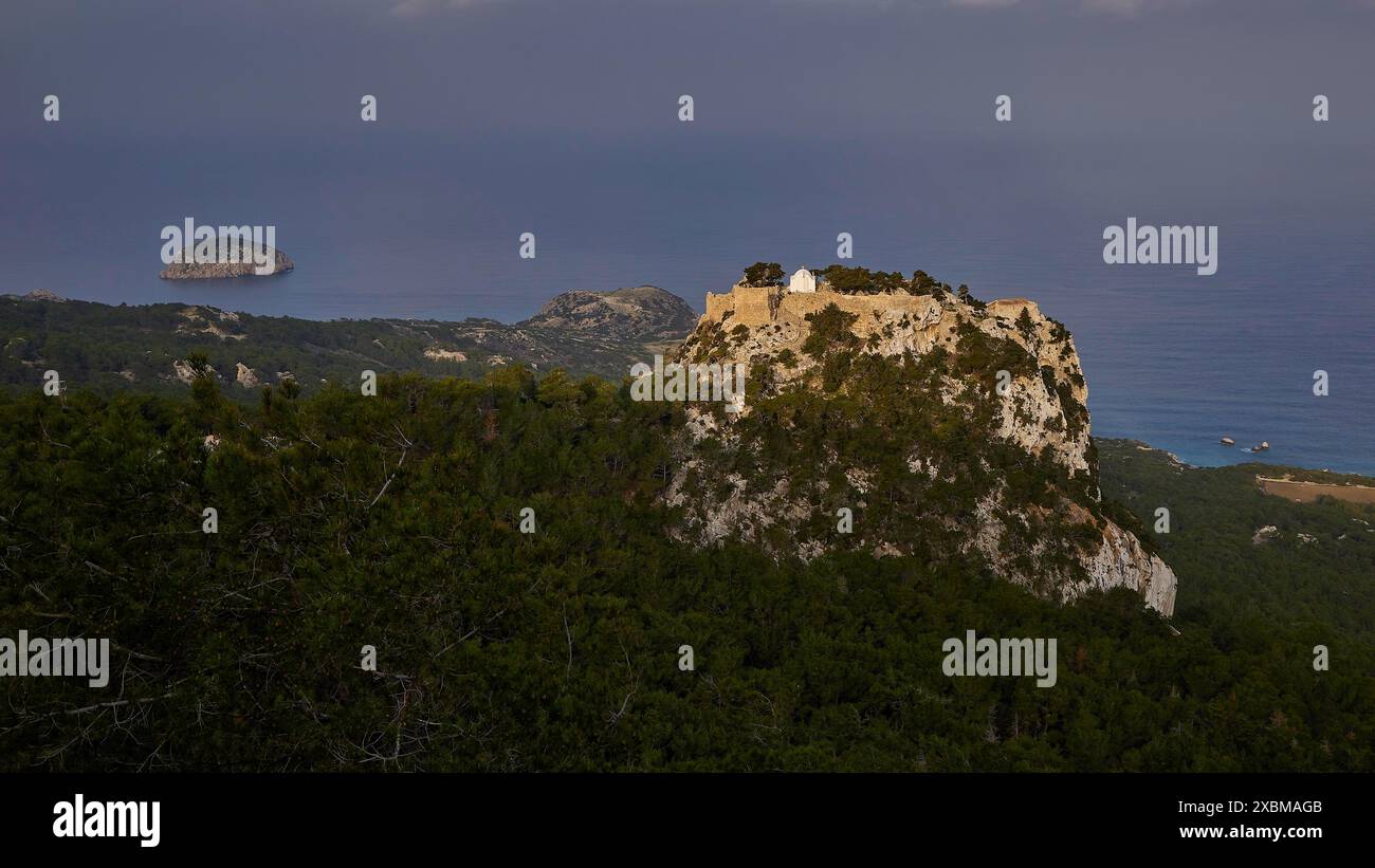 A small castle on a high rock with dense forests and views of the sea ...