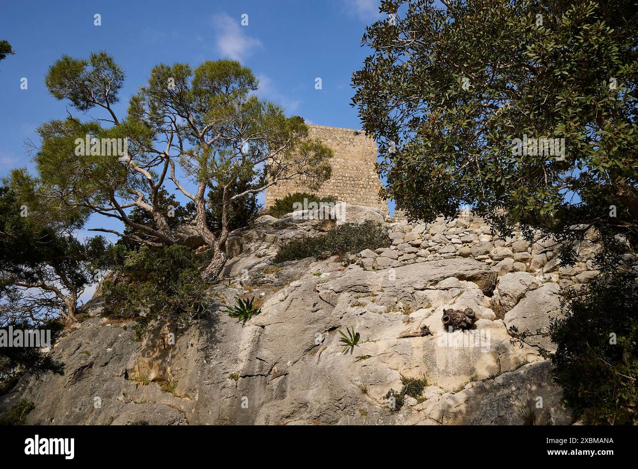 Ancient building on a rock surrounded by trees and nature, Kastro ...