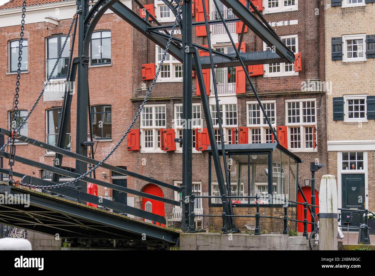 Detailed decorated bridge in front of residential buildings with bright ...