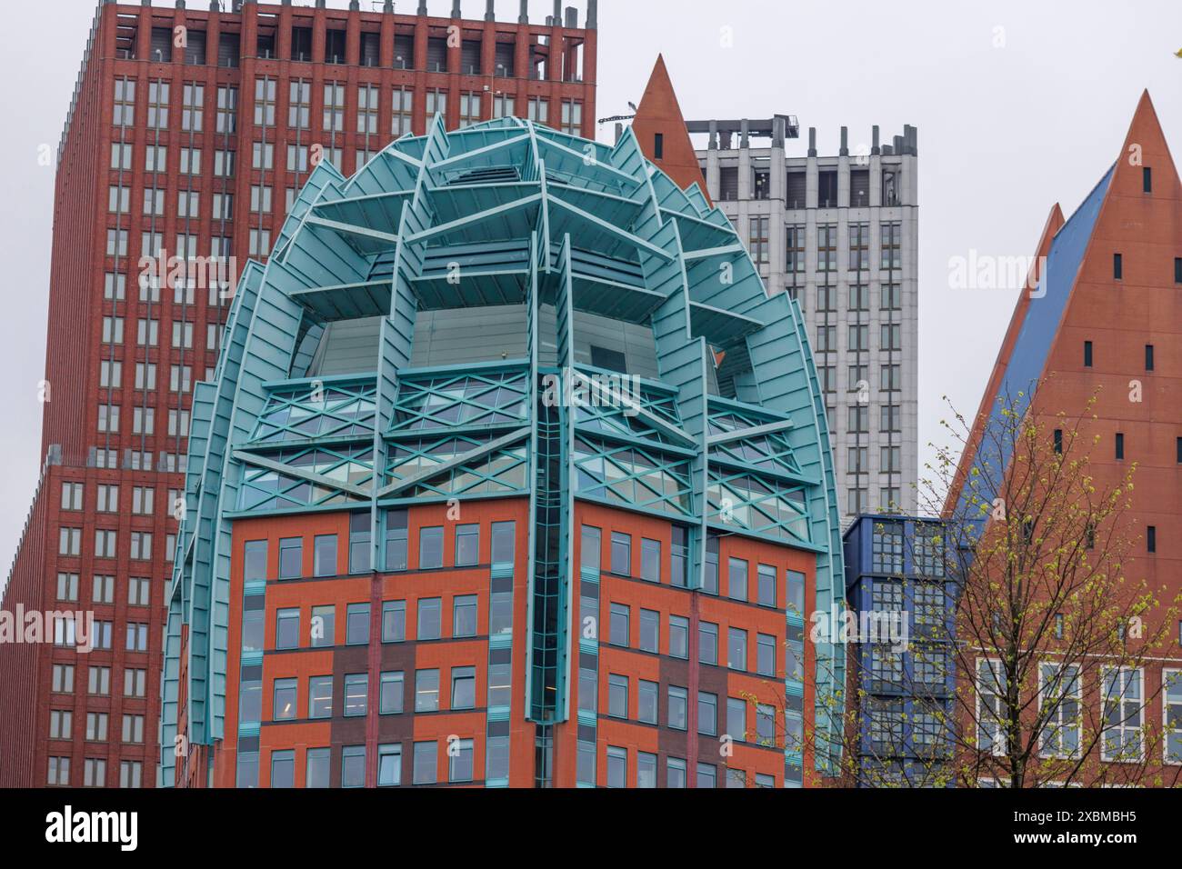 Detailed view of a modern skyscraper with a unique design, surrounded ...