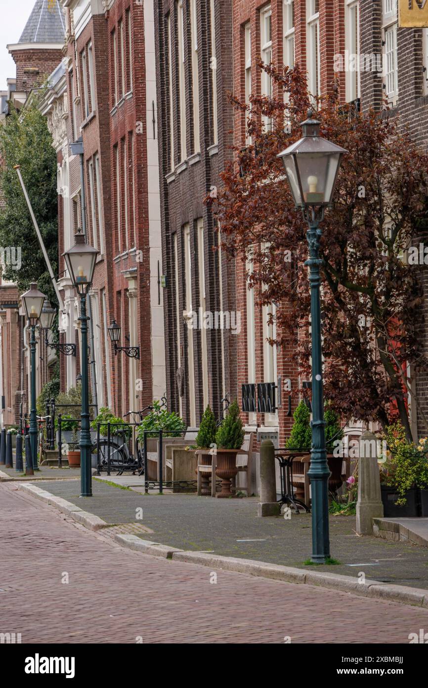 Historic city street with classic lanterns and neat brick buildings ...