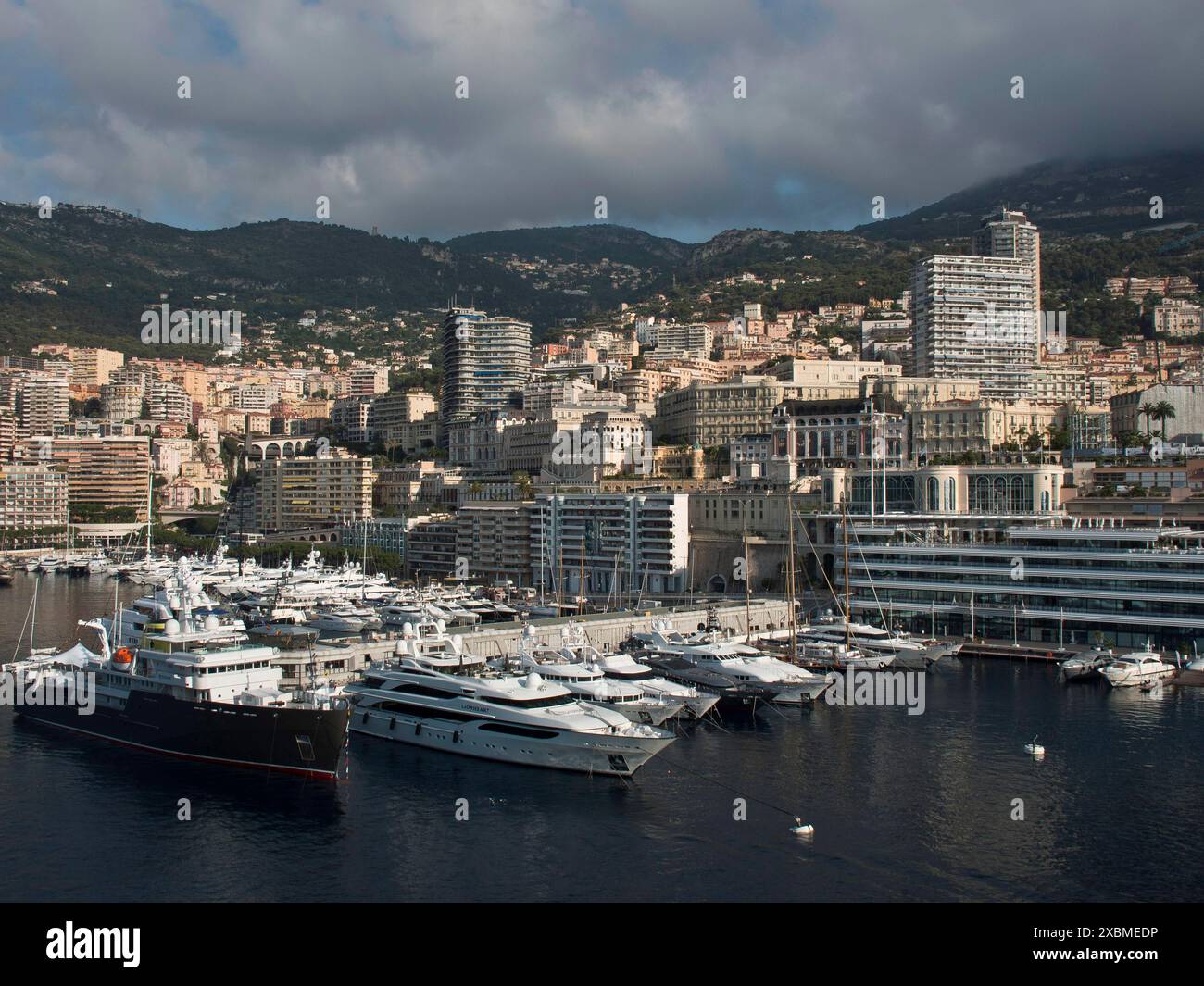 Scene of the marina with numerous boats in front of cloud-covered ...