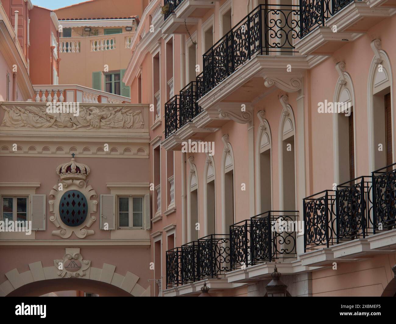 Elegant buildings with balconies and decorative facades in a lively ...