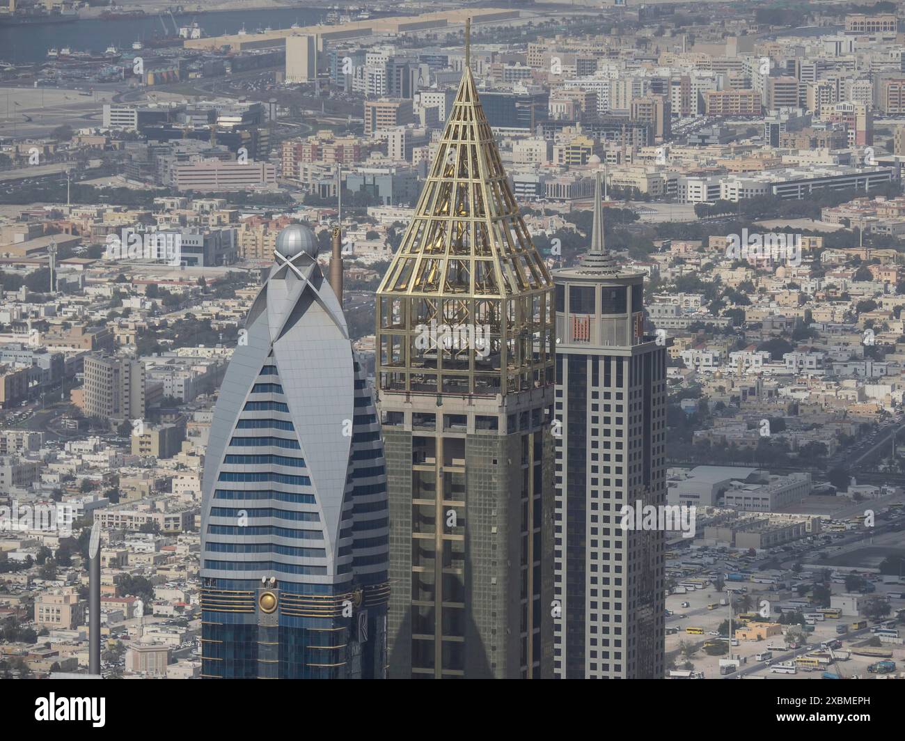 Close-up of two modern towers with striking architecture in a dense ...