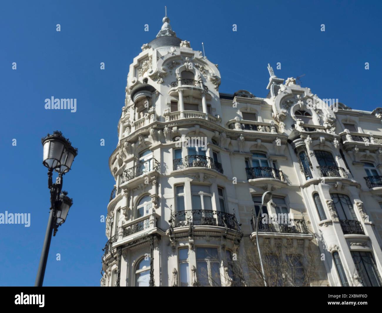 Decorative building with many windows and balconies under a clear blue ...