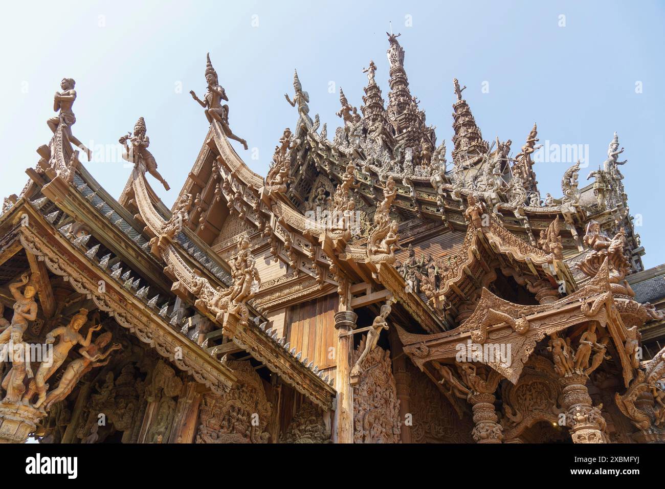 Close-up of an ornately carved wooden temple with lots of detail ...