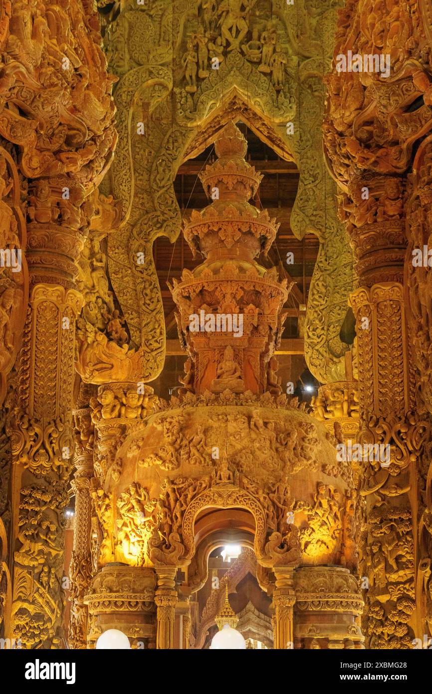 Interior view of an ornately carved wooden temple with magnificent ...