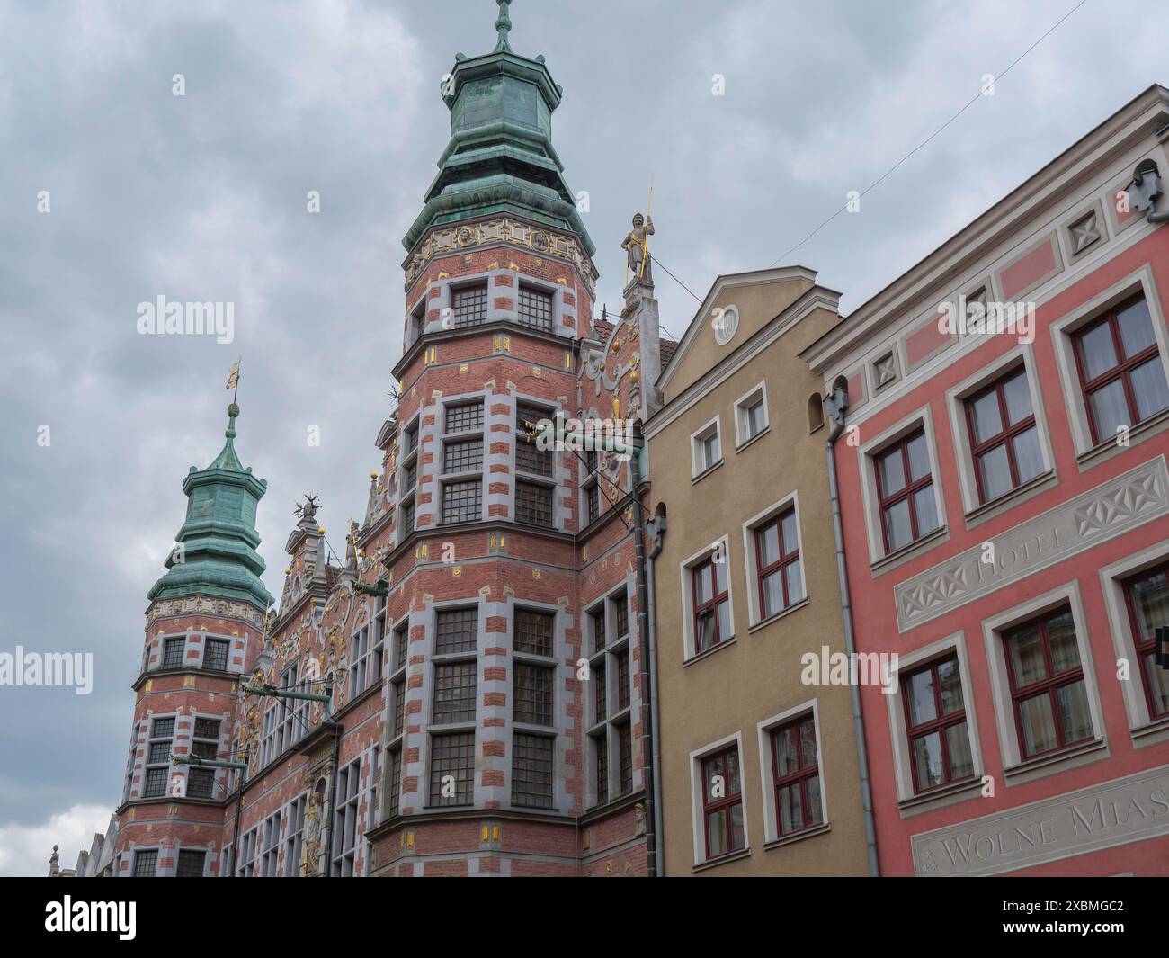 Historic, ornate buildings with towers and numerous windows under a ...