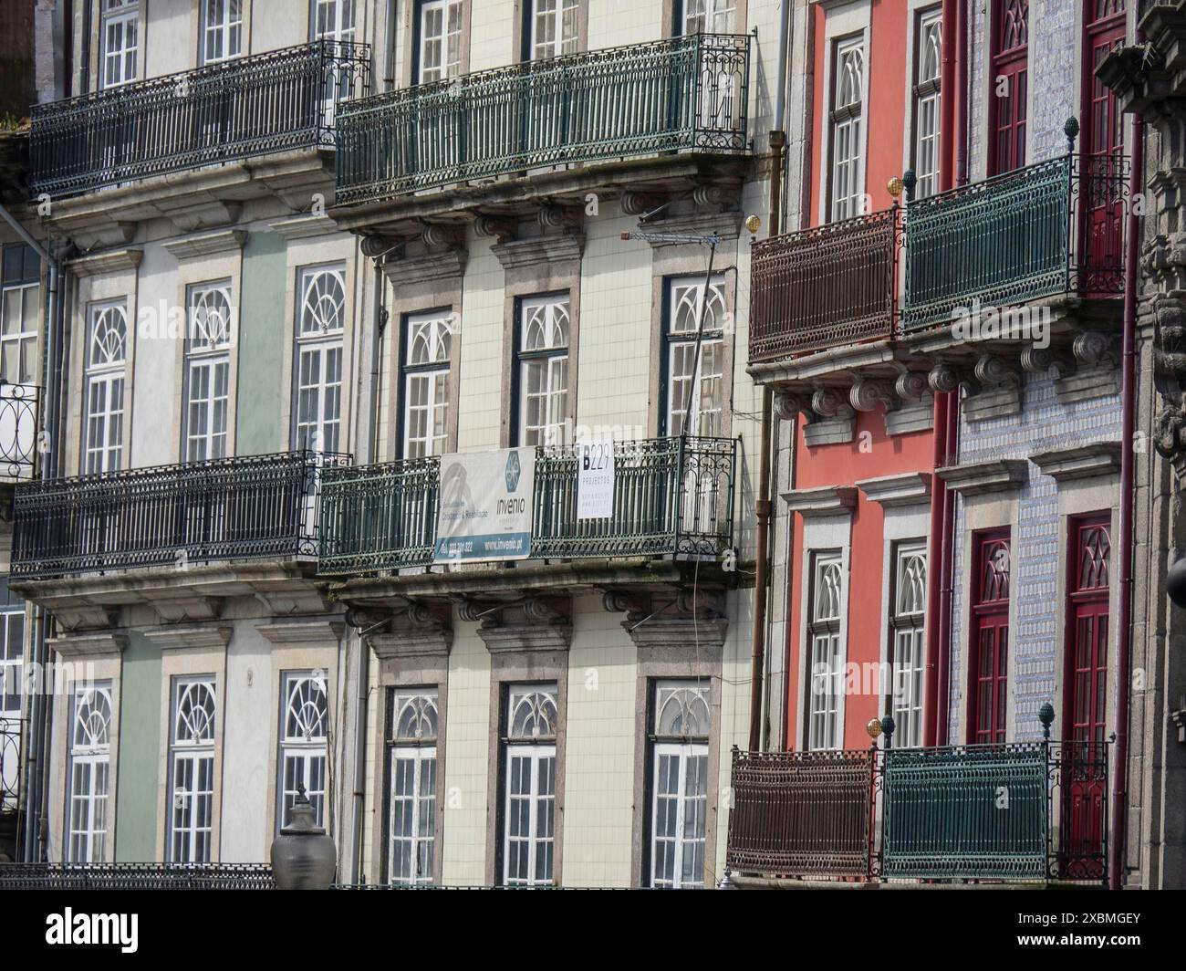 Multi-storey buildings with balconies and various window facades in a ...