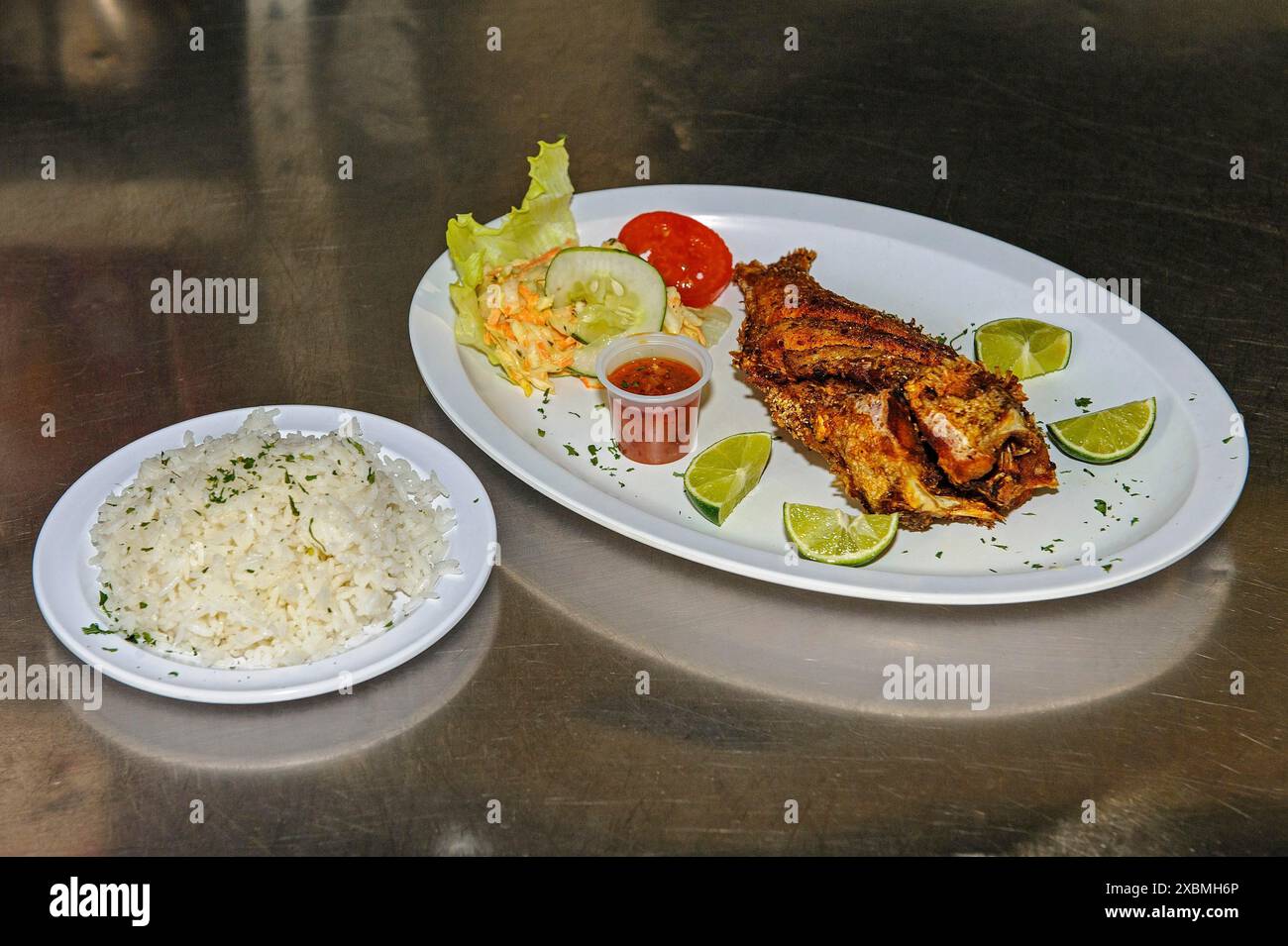 Pan-fried fish dish with Caribbean invasive lionfish (Pterois miles ...