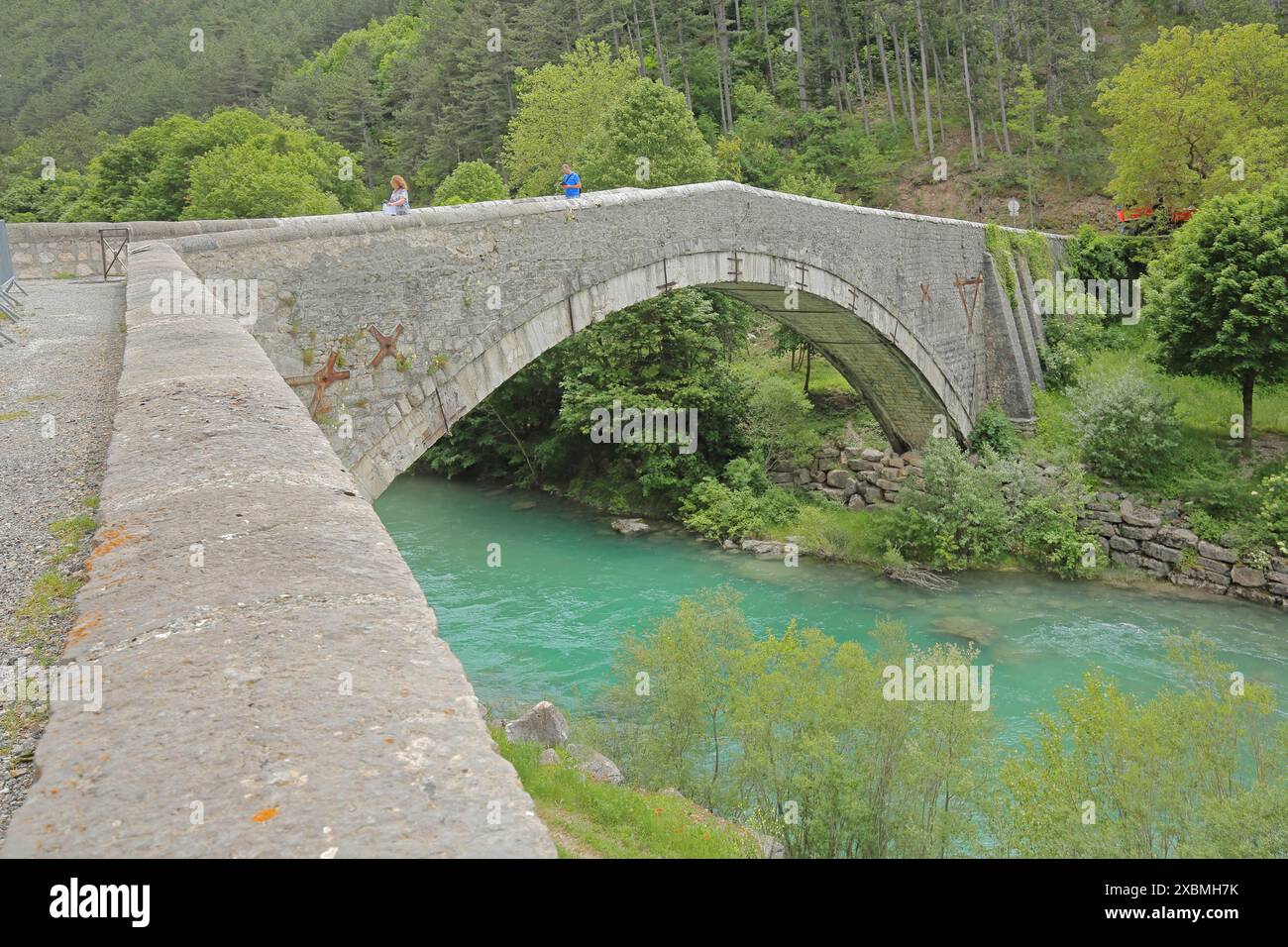 Stone arch bridge Pont du Roc built 15th century over the river Verdon ...
