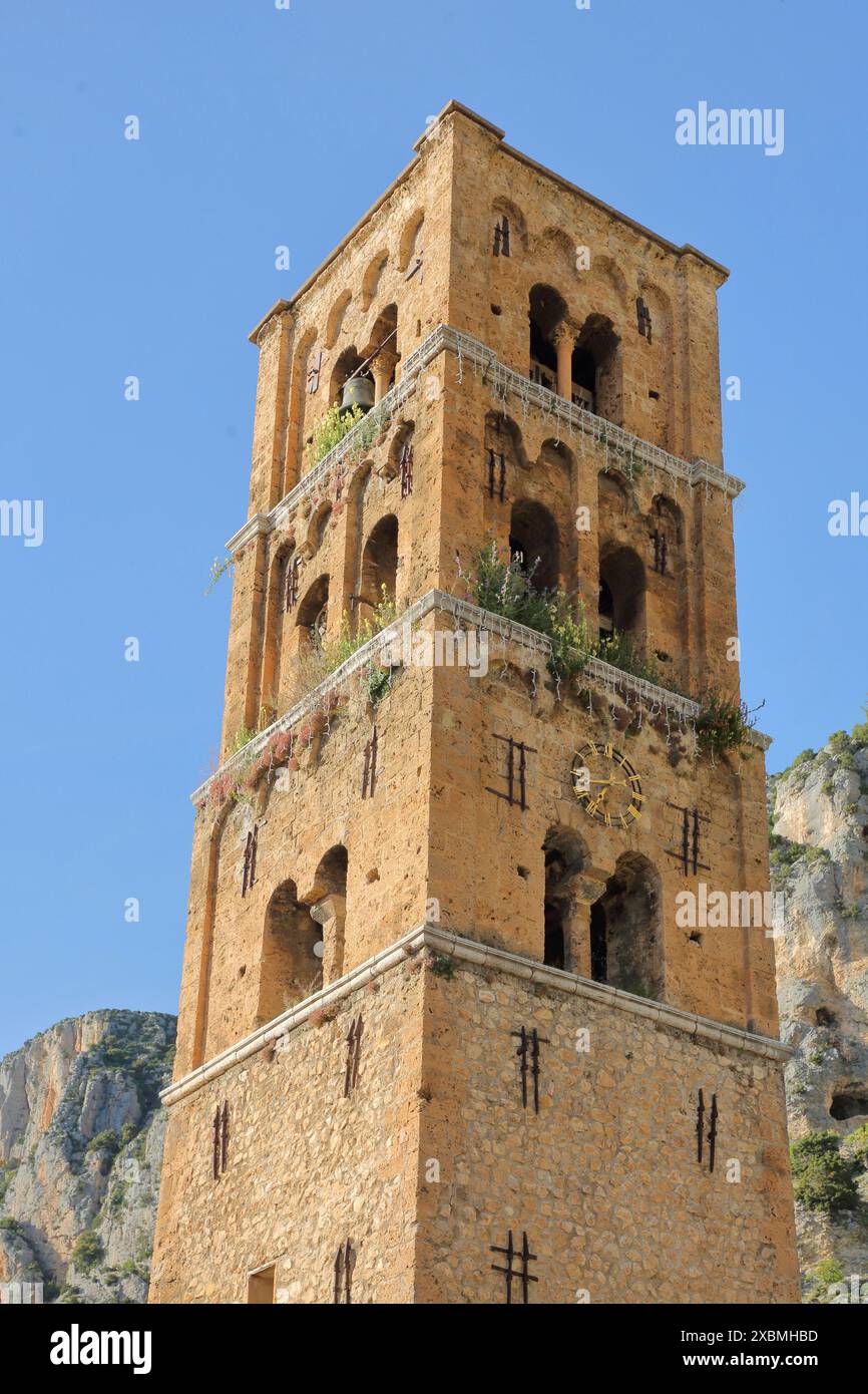 Church tower of Notre-Dame-de-l'Assomption, mountain village, Moustiers ...