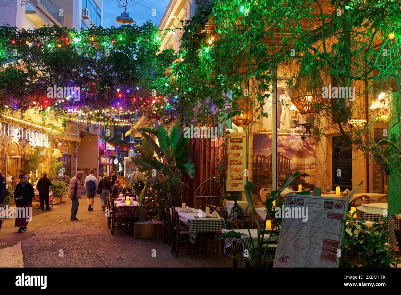 Colourful illuminated alley with restaurants, nightlife district Psirri ...
