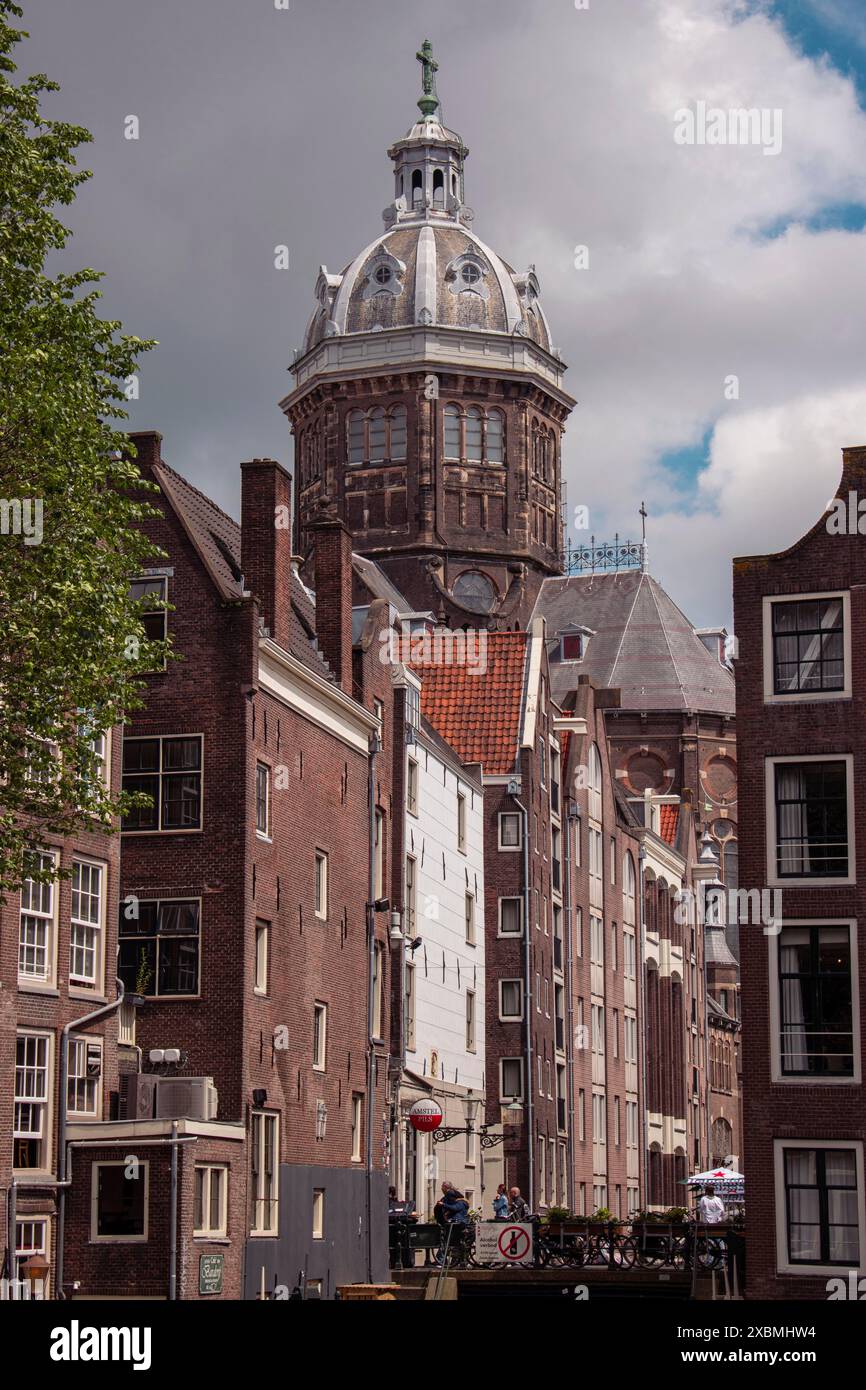 Old town street with historic brick buildings and church tower in the ...