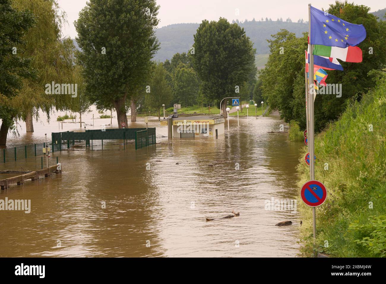 The access road and reception of a campsite are flooded by the high ...