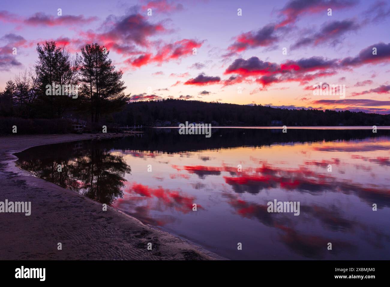Red cloudy sunrise sky, long exposure with water reflection Stock Photo ...