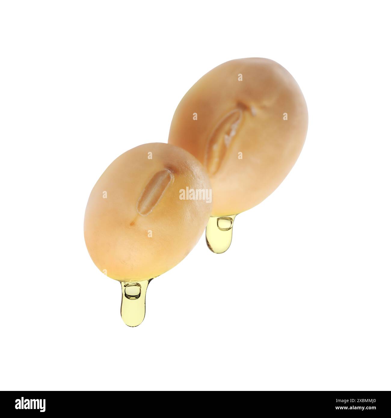 Cooking oil dripping from soybeans on white background Stock Photo - Alamy