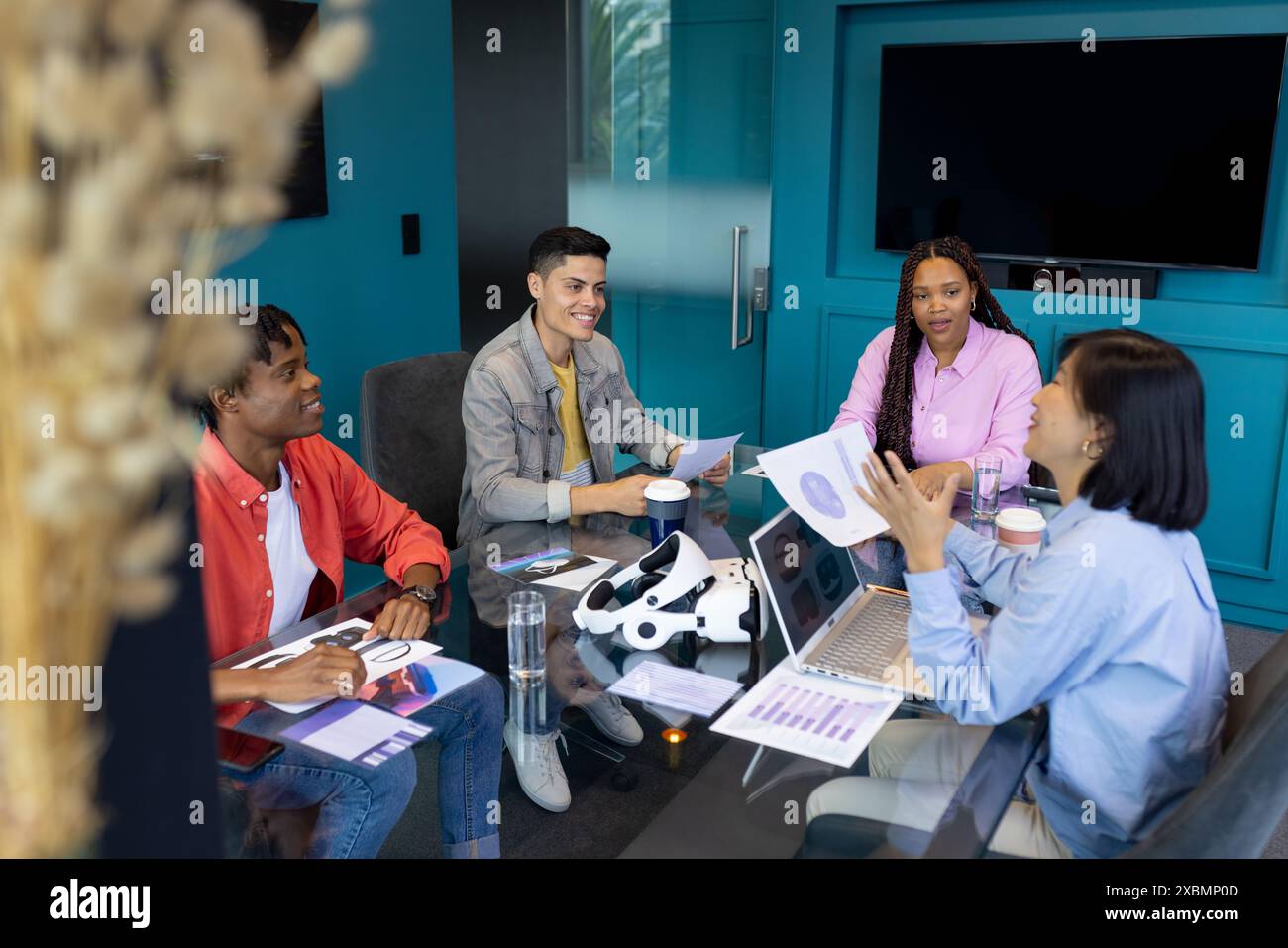 professionals in a modern office discuss strategies for promoting ...