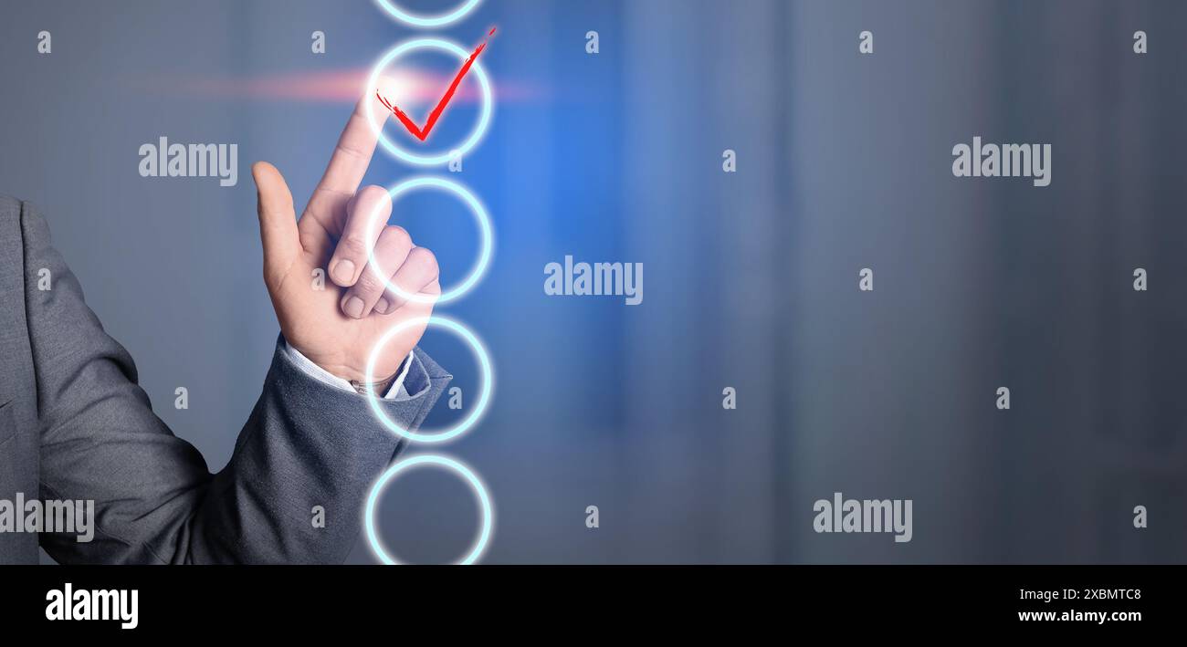 Man using virtual screen with check list on dark background Stock Photo ...