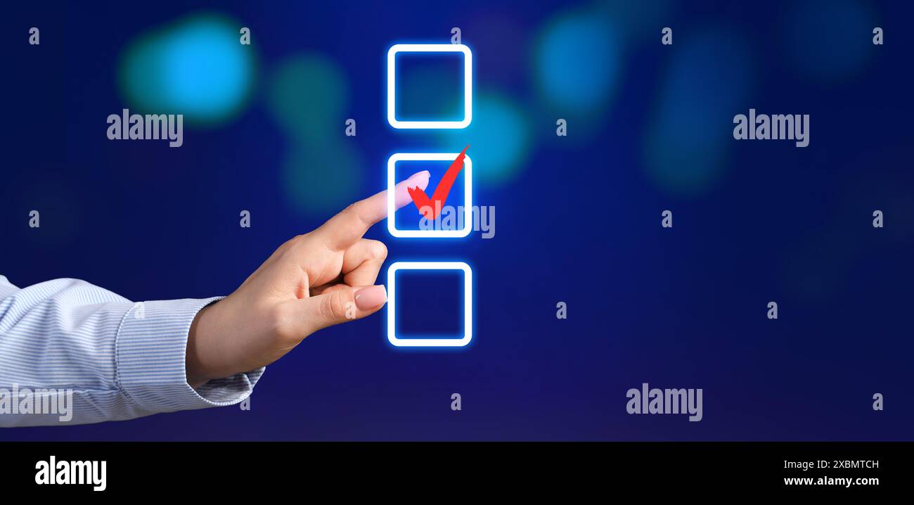 Woman using virtual screen with check list on dark background Stock ...