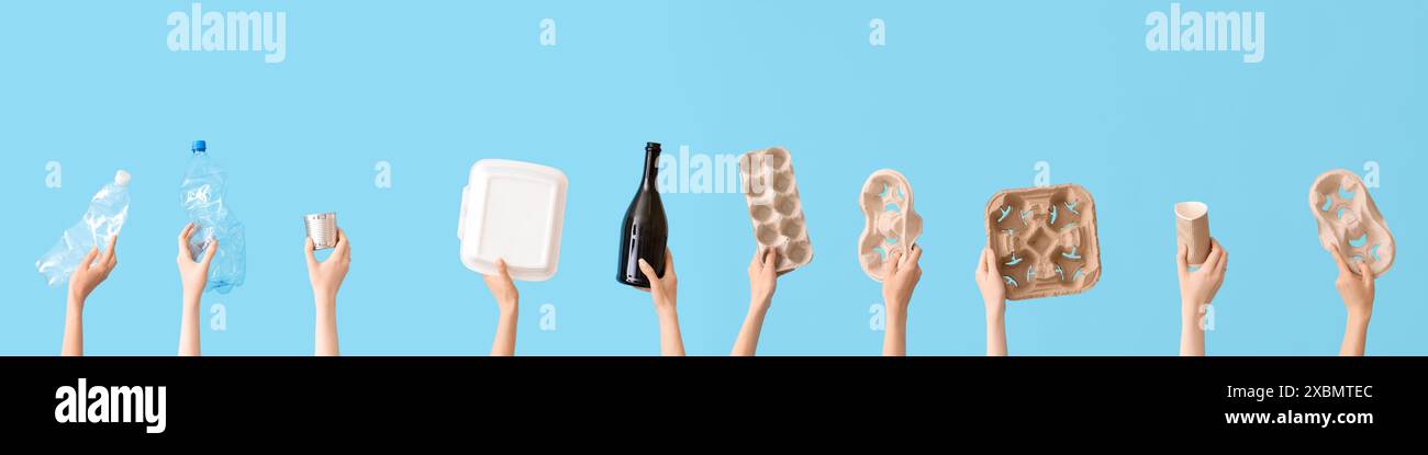 Many hands with garbage on light blue background. Concept of recycling ...