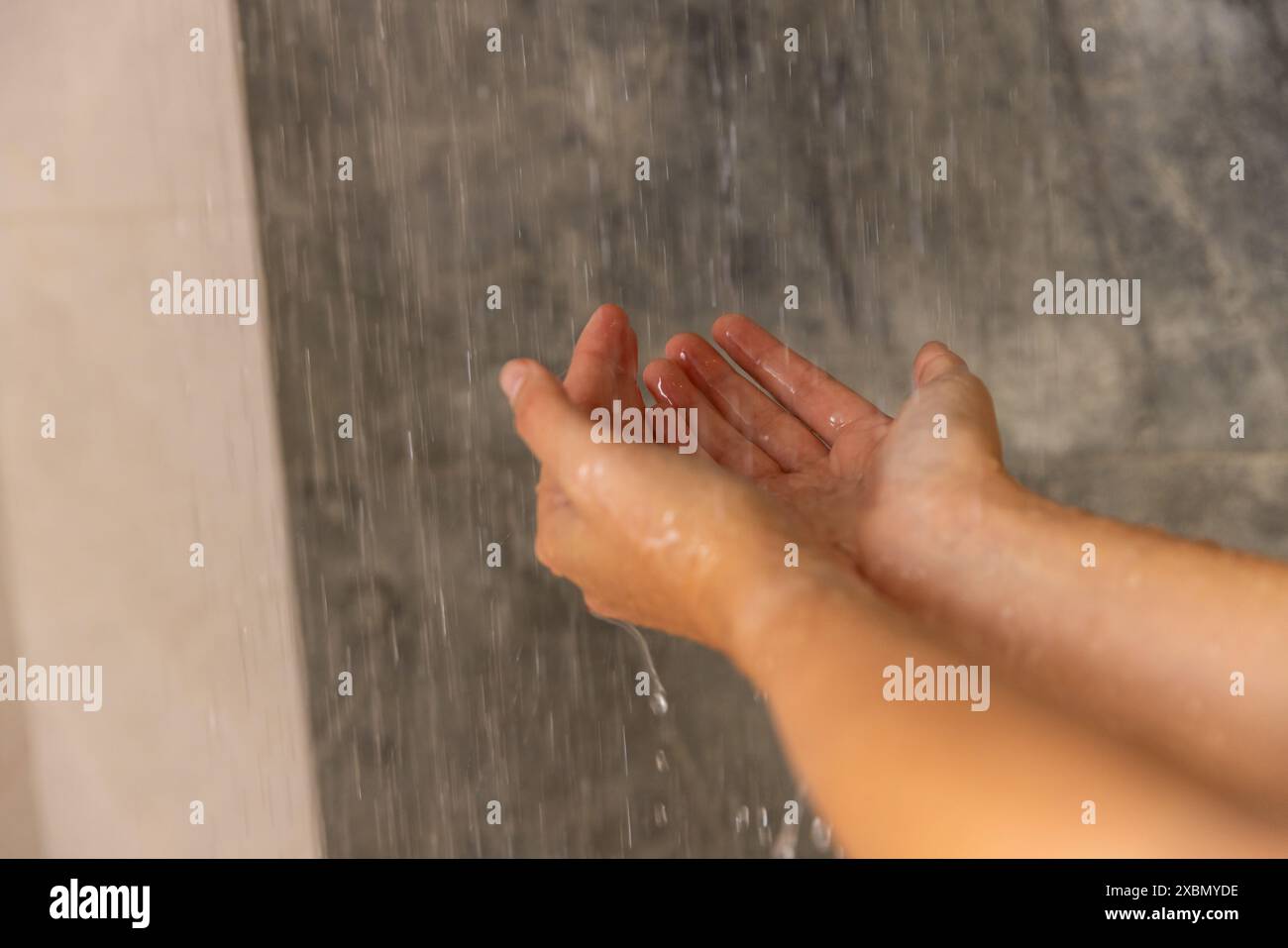 Hands of woman touching water from shower in bathroom, copy space Stock ...