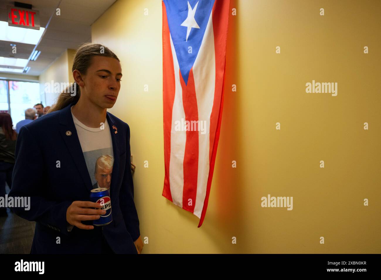 Bode Brewer, 17, wears a shirt featuring former President Donald Trump ...