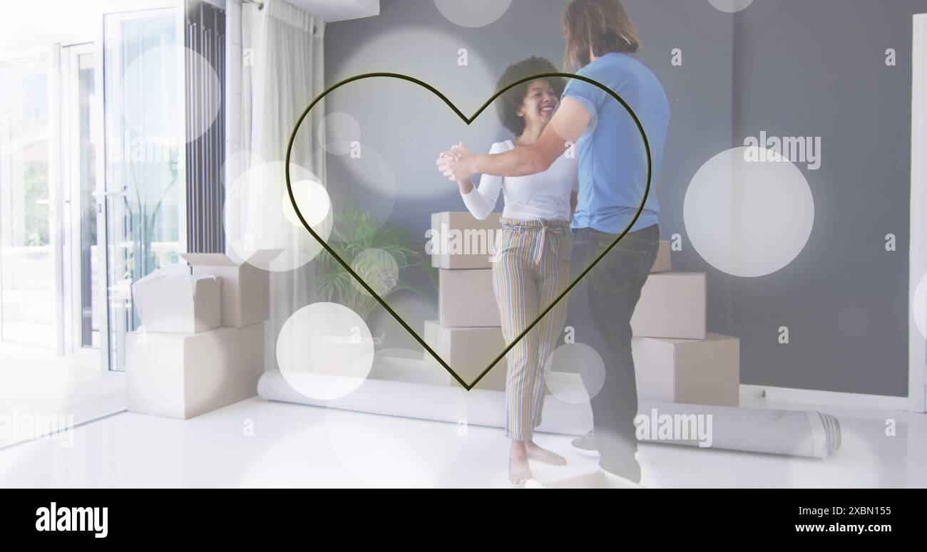 Image of yellow neon heart and white spots over happy diverse couple ...