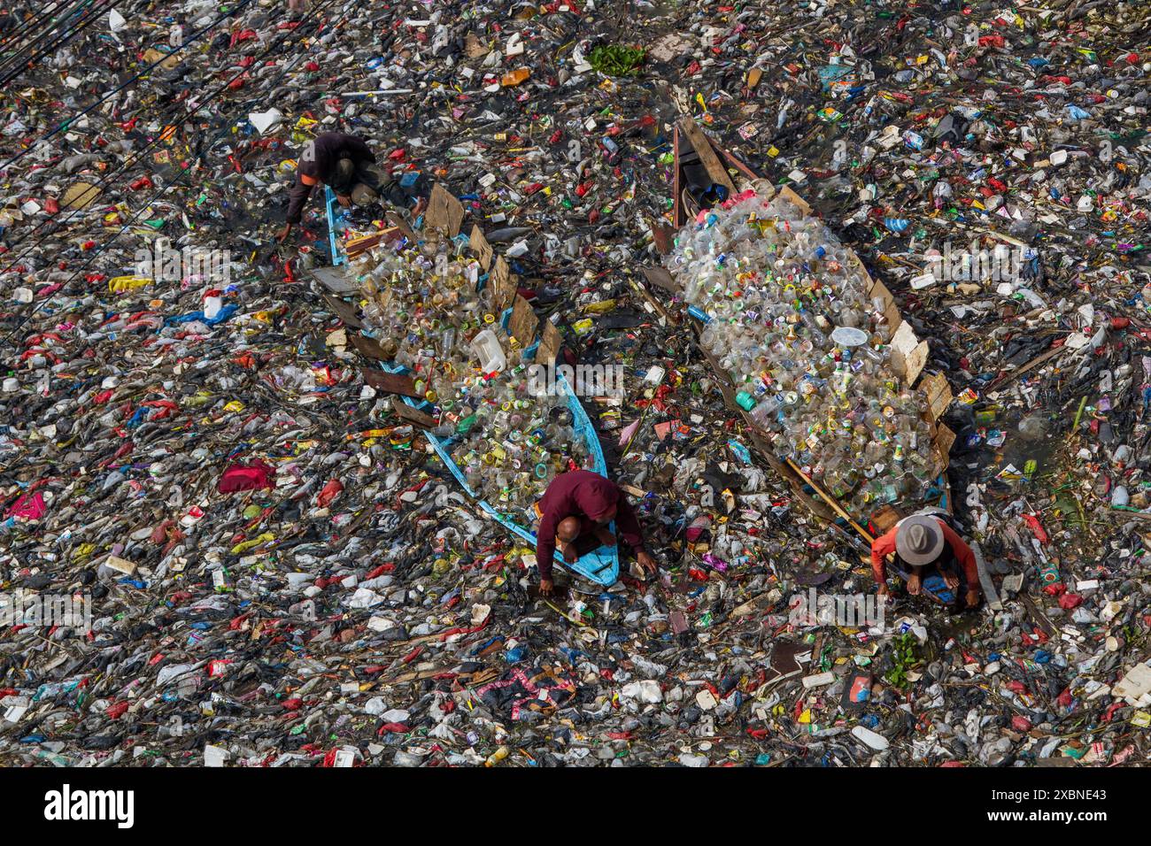 June 12, 2024, Bandung, West Java, Indonesia: Residents on boats are ...