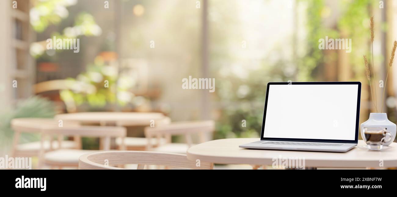 A laptop computer with a white-screen mockup, a coffee cup and a ...