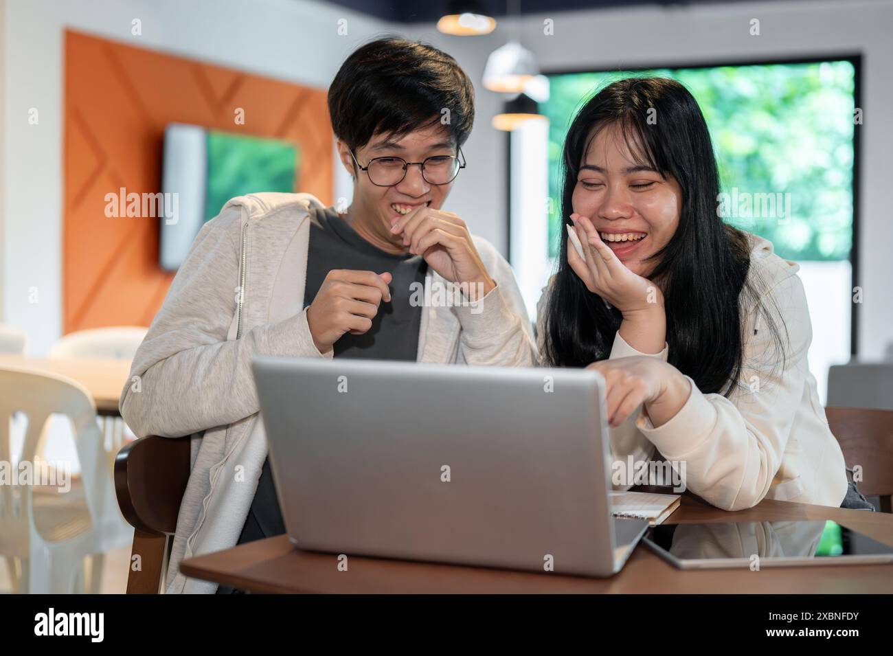Two students discuss something in hi-res stock photography and images ...