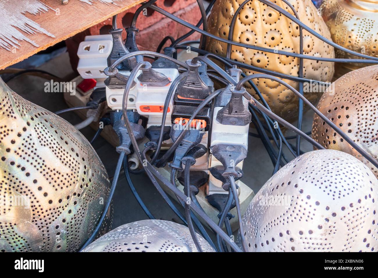 Old and damaged electric adapter power plug has many appliances are ...